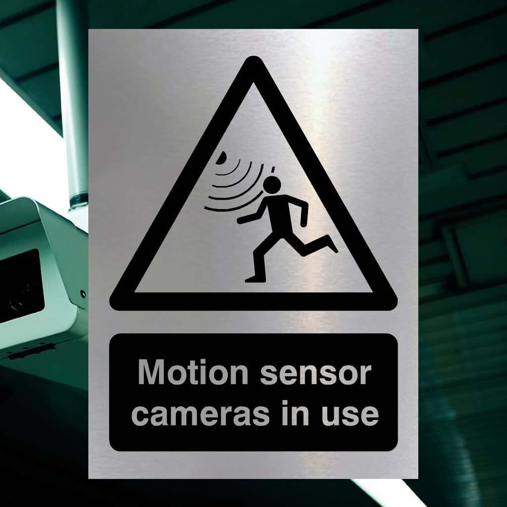 Motion Sensor Cameras In Use Sign in Brushed Silver